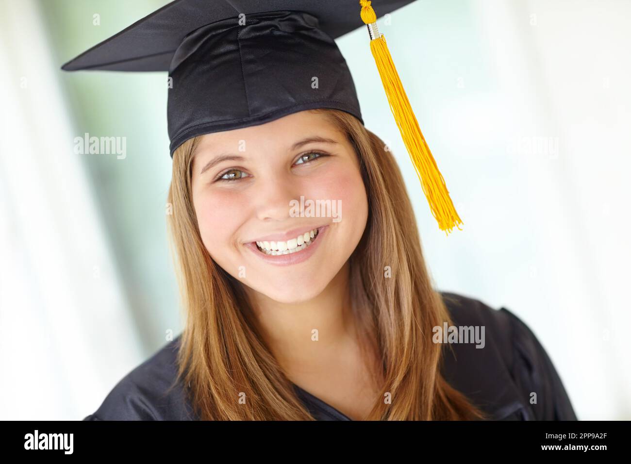 She graduated with flying colours. Head and shoulders portrait of a ...