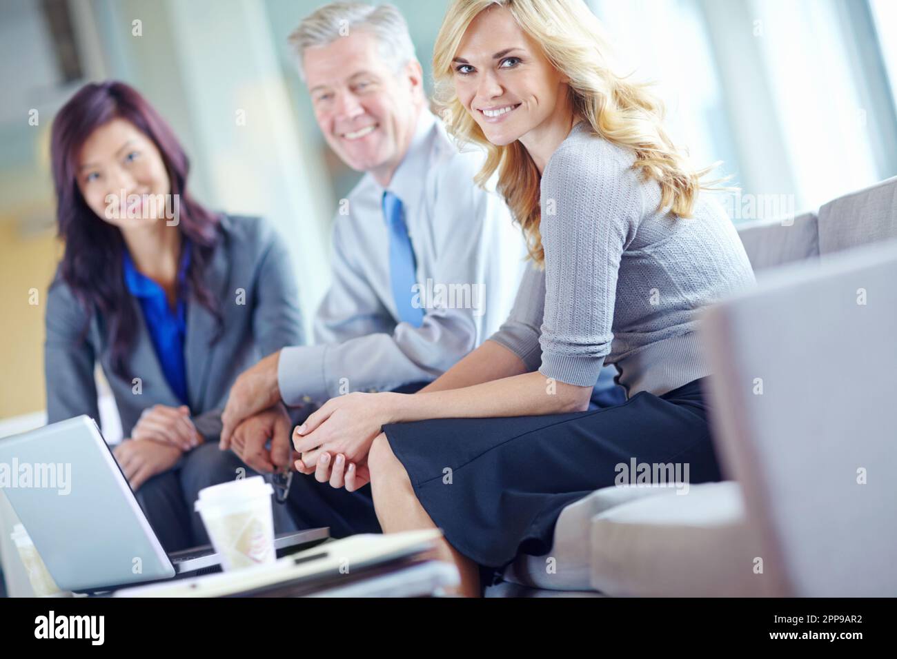 Theyre a committed team of planners. Three businesspeople sitting ...