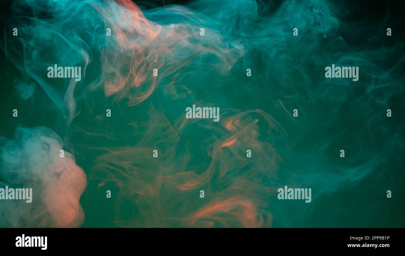 Orange smoke texture on an emerald background Stock Photo - Alamy