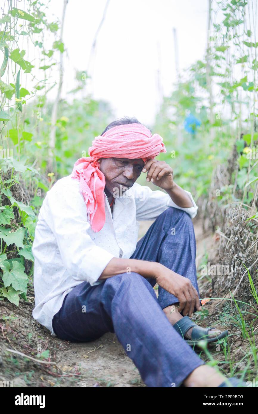 Indian poor farmer in farm, sad farmer, loss of farmer Stock Photo - Alamy