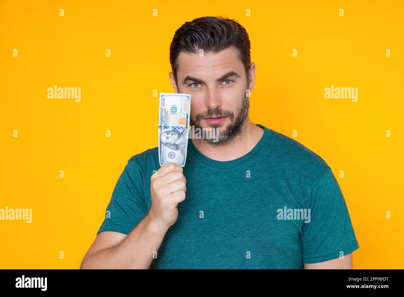 Man with money cash. Dollar banknotes. Portrait of man holding bunch of ...
