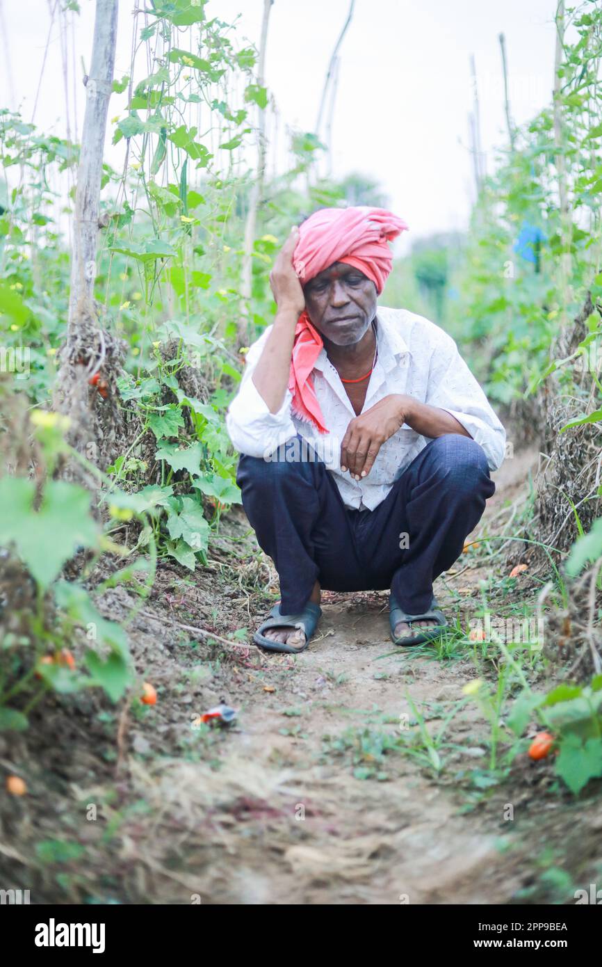 Indian poor farmer in farm, sad farmer, loss of farmer Stock Photo - Alamy