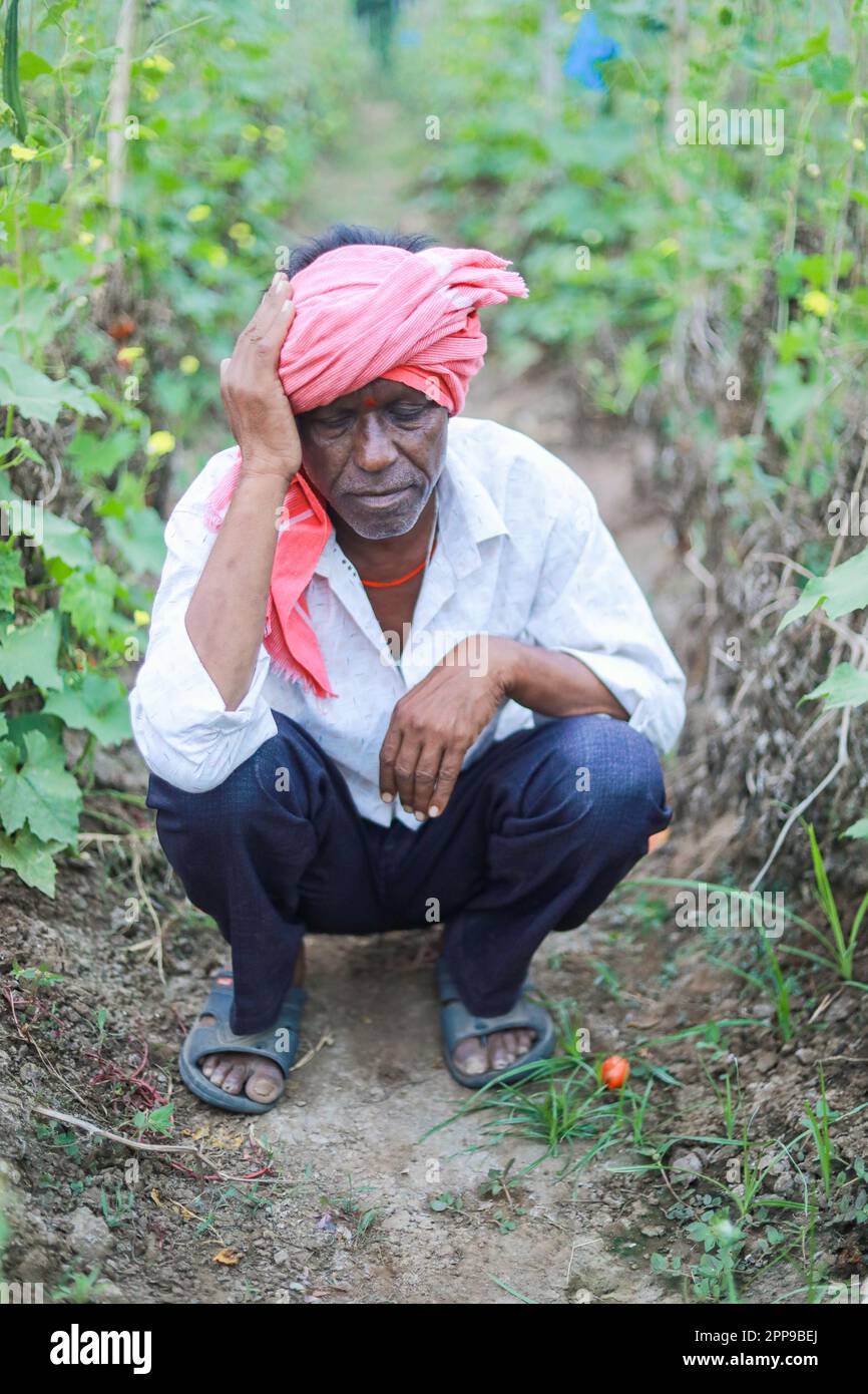 Indian poor farmer in farm, sad farmer, loss of farmer Stock Photo - Alamy