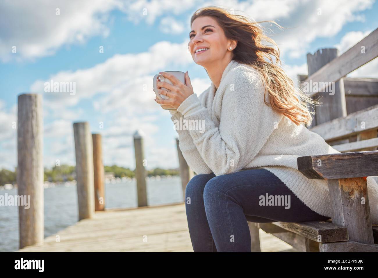 I can smell Autumn dancing in the breeze. a beautiful young woman ...