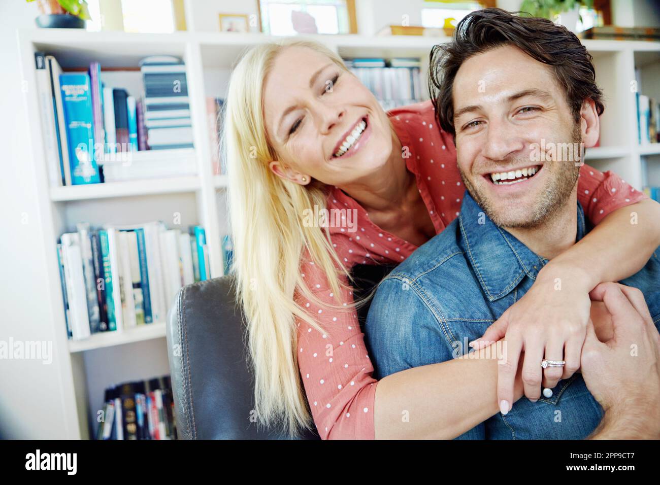 Bear hugs for my beau. an affectionate couple relaxing together at home ...