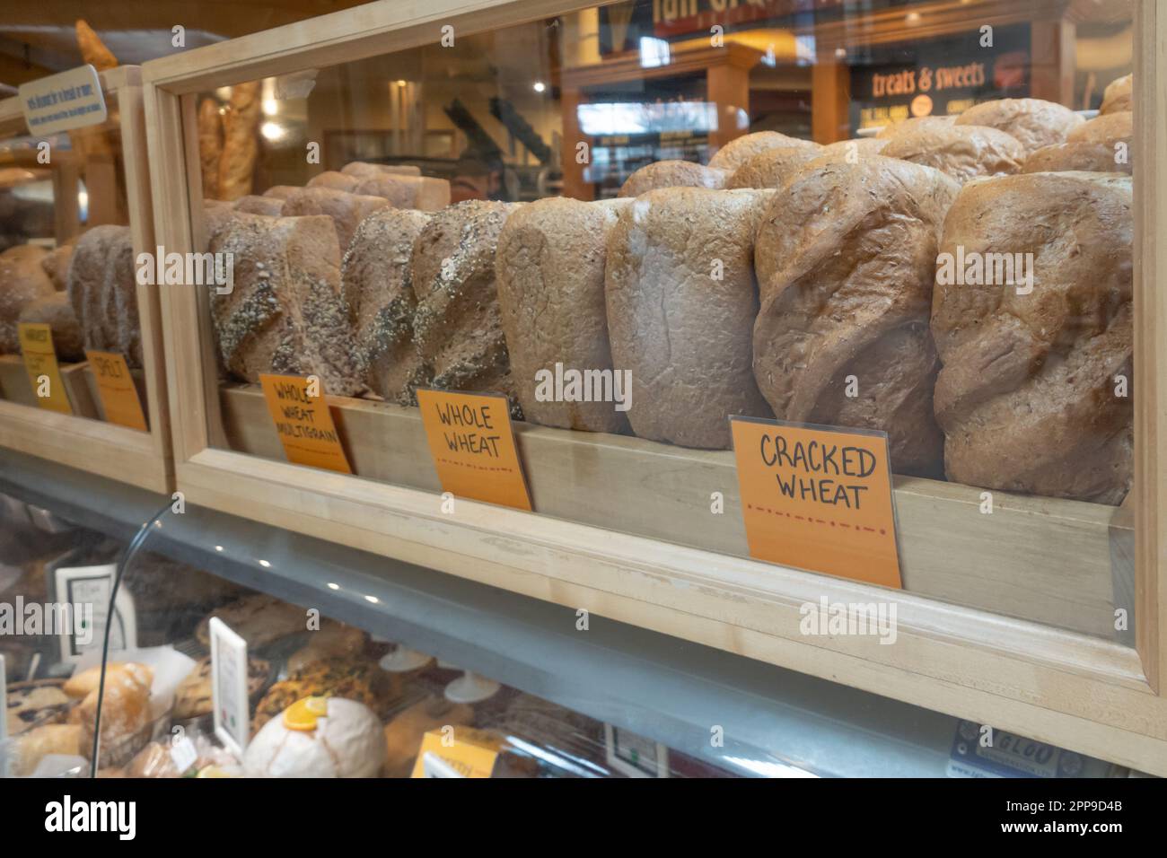 Loaves of bread on display in bakery Stock Photo - Alamy