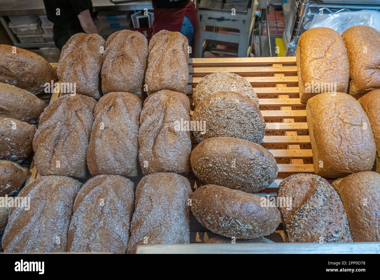 Loaves of bread on display in bakery Stock Photo - Alamy