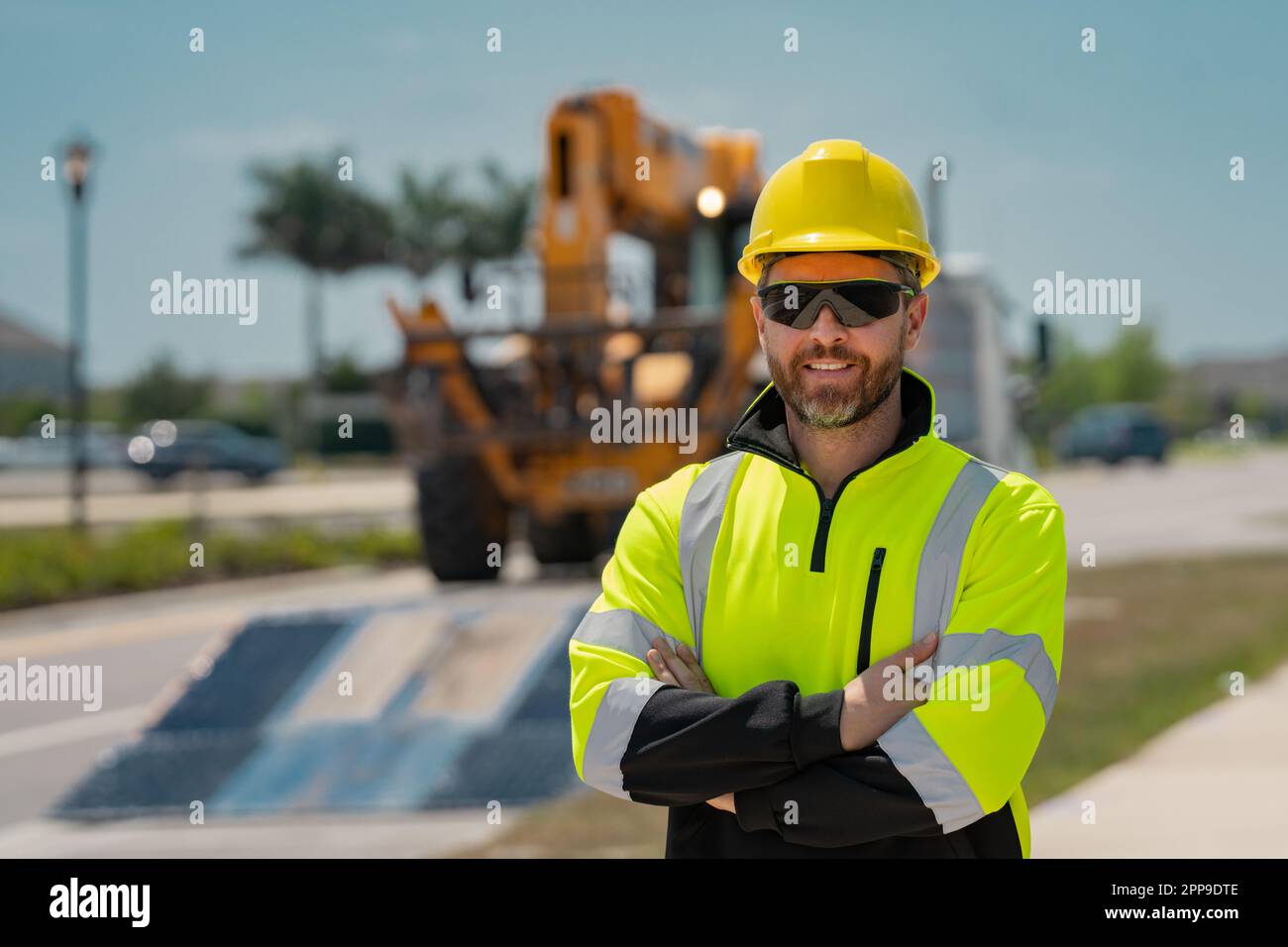 Machinery builder at buildings background. Excavator loader tractor and ...