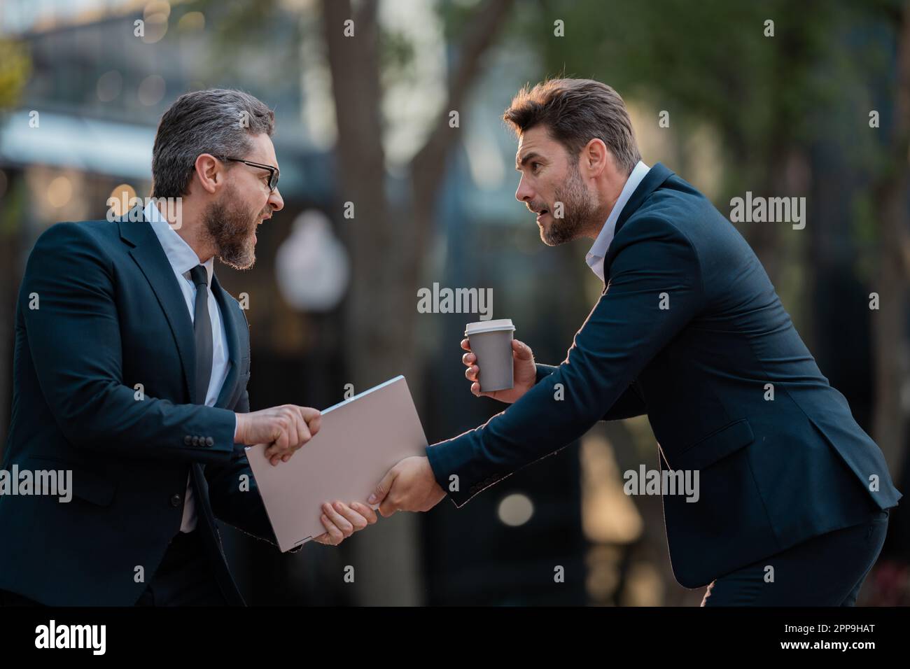 Business fight. Businessmen fighting outdoor. Angry office workers in ...