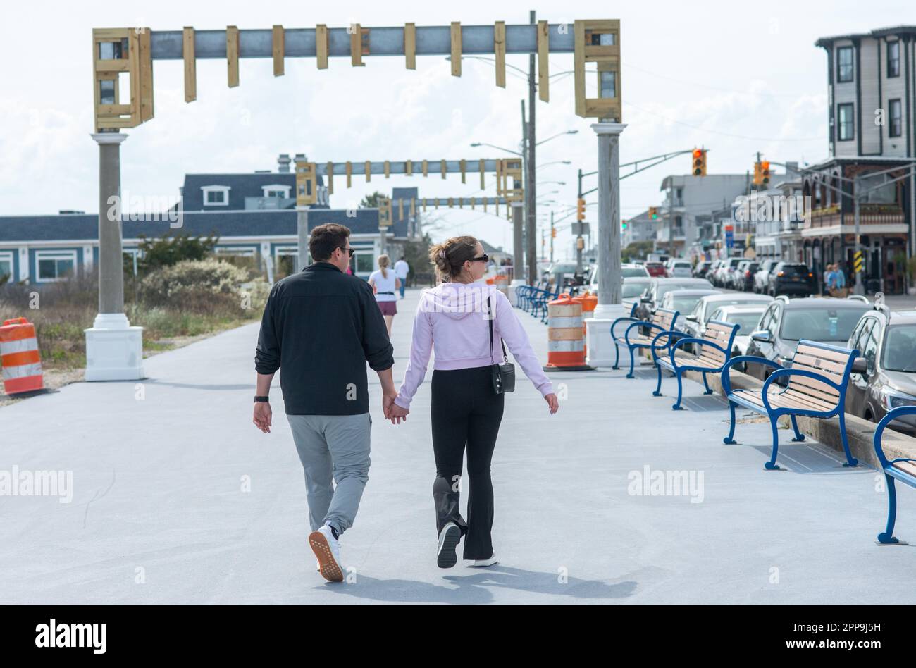 Cape May, United States. 22nd Apr, 2023. A couple holds hands as they ...