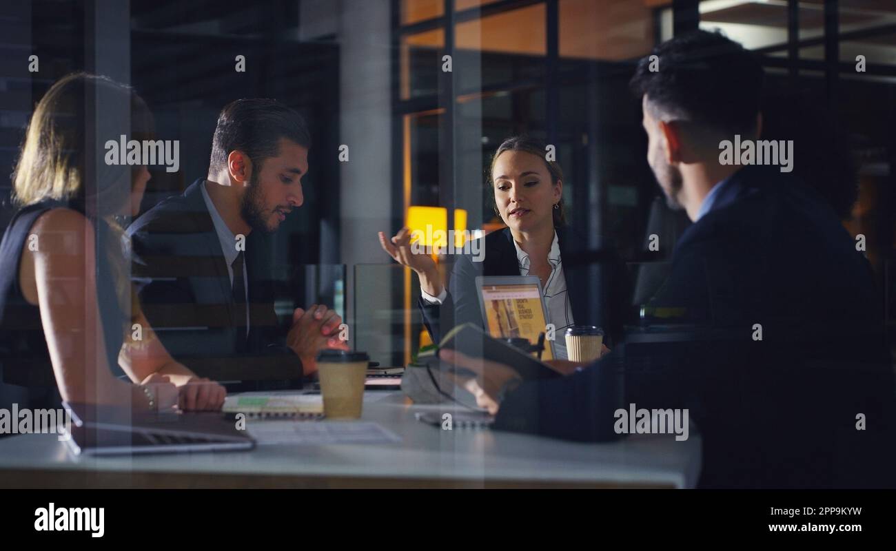 Taking success one meeting at a time. a diverse group of businesspeople ...