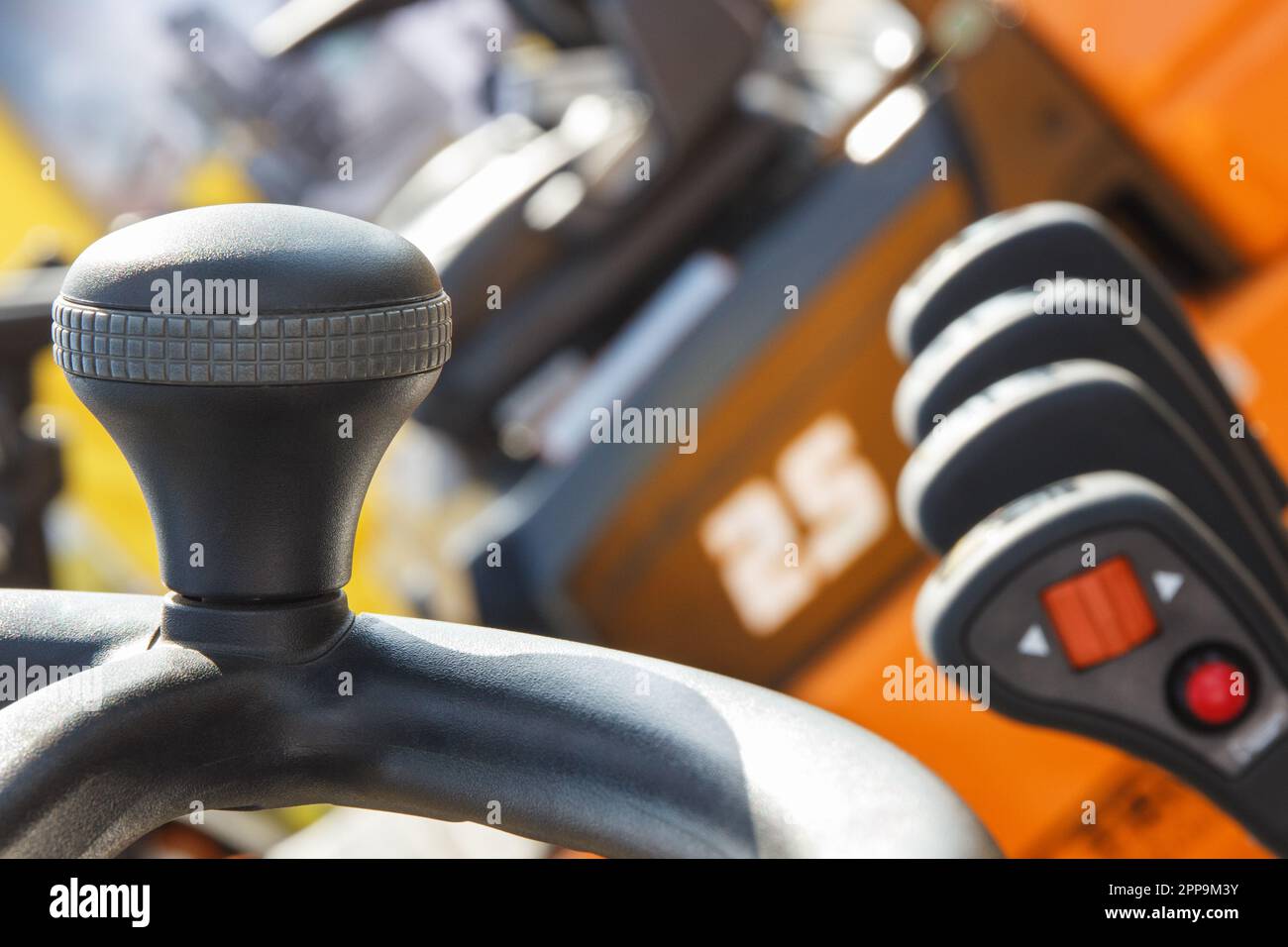 Steering wheel and operating control panels or levers with buttons in ...