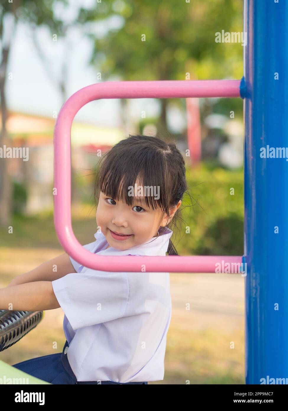 Happy kid, asian baby child in school uniform playing on playground ...
