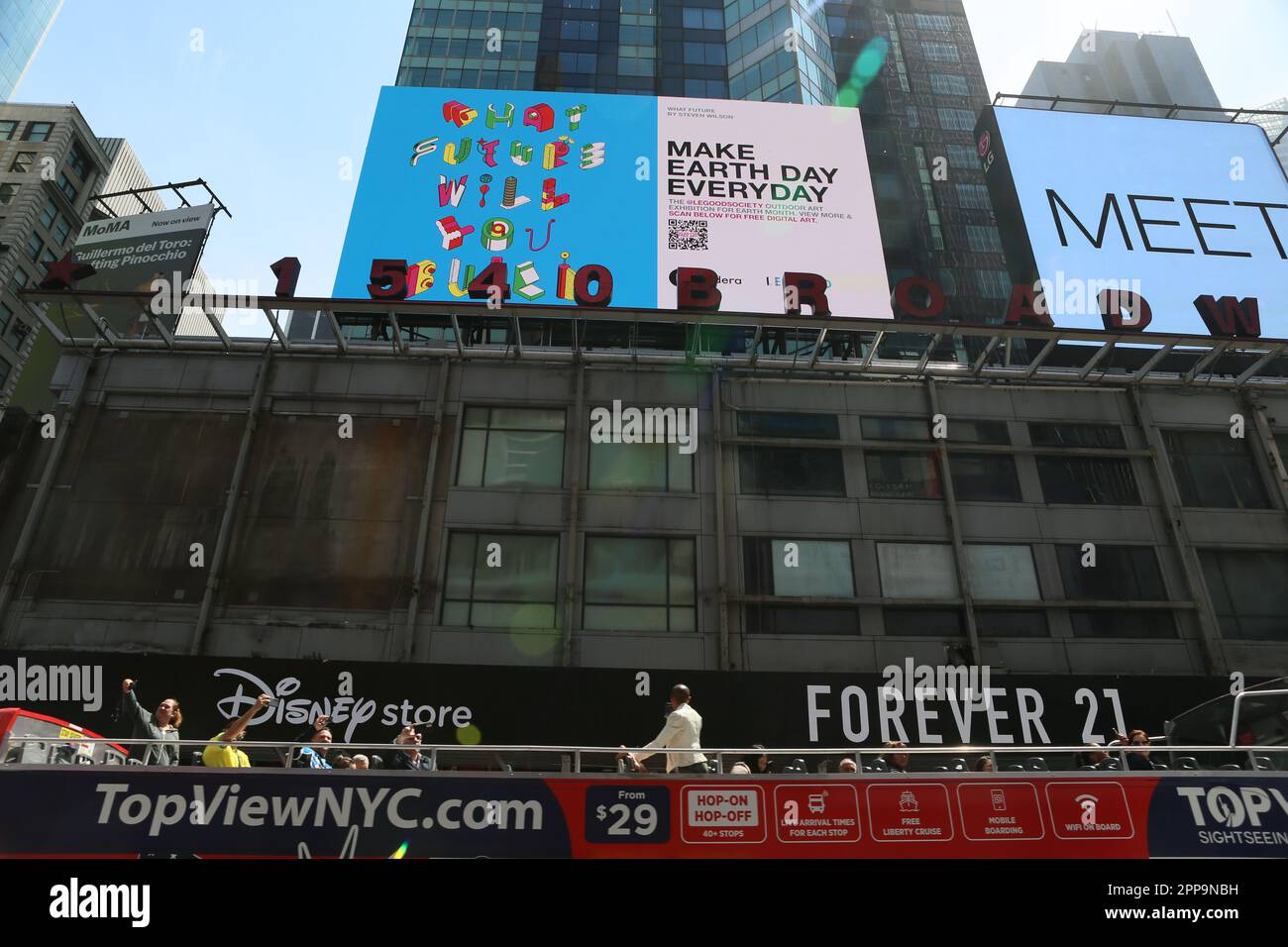 New York, USA. 22nd Apr, 2023. A tourism bus passes by an Earth Day ...