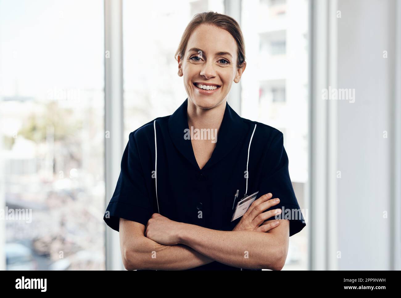 Shes all the care you need. a young female caregiver smiling at the ...