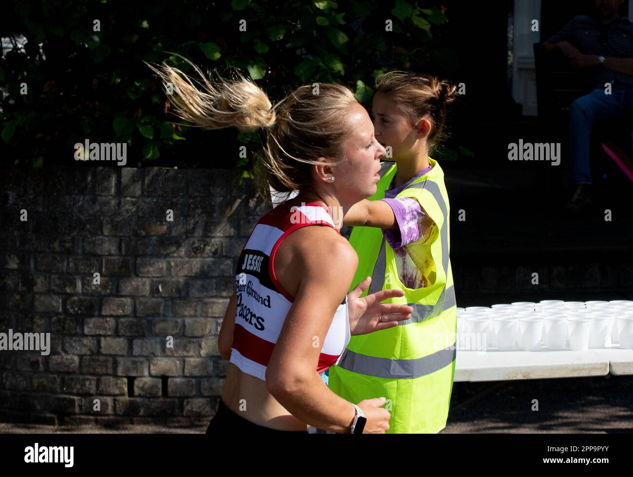 Flying ponytail of woman runner competing in the Framlingham Flyers ...