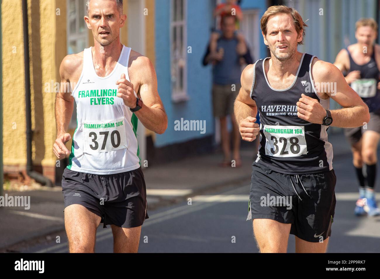 Two male runners competing in the Framlingham Flyer's 10km race on open ...
