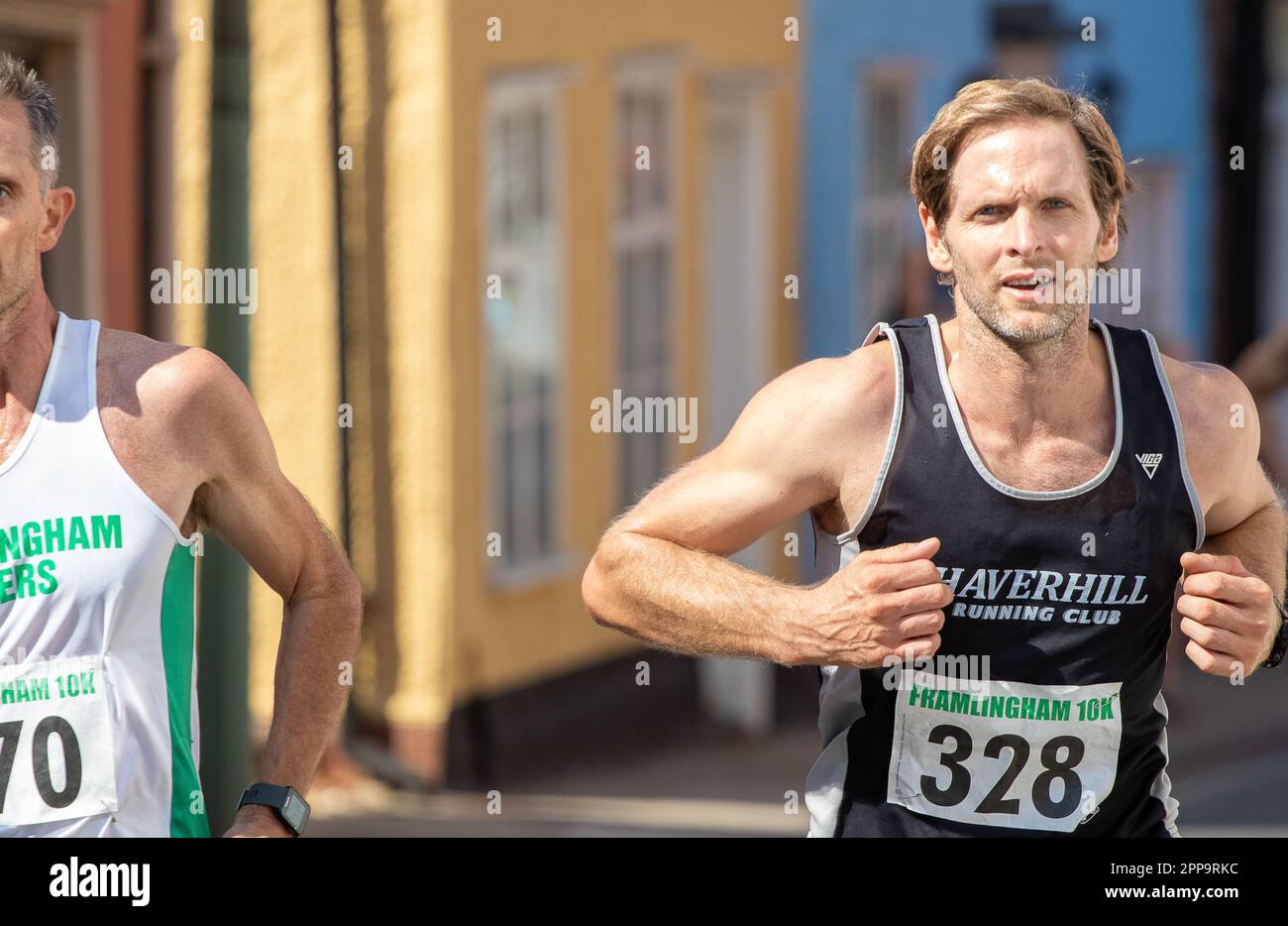 Two male runners competing in the Framlingham Flyer's 10km race on open ...