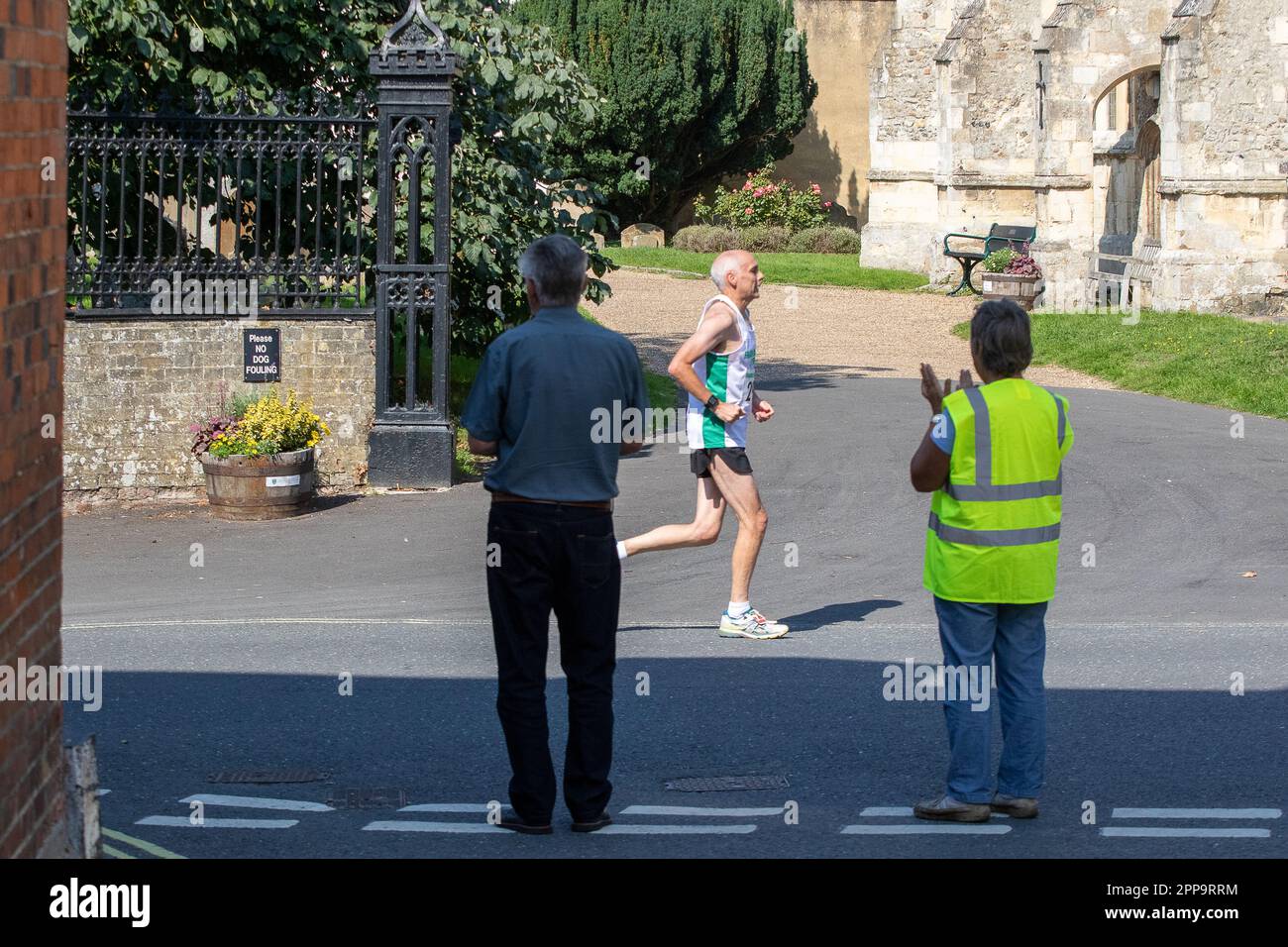 Slightly older runner in the Framlingham Flyer's 10k road race passing ...