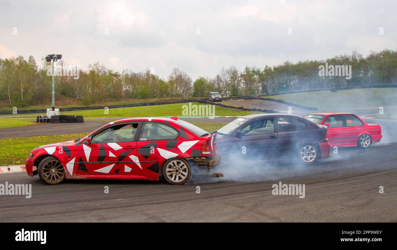 Red BMW 325 Ti, burning rubber and tires screeching at Three Sisters ...