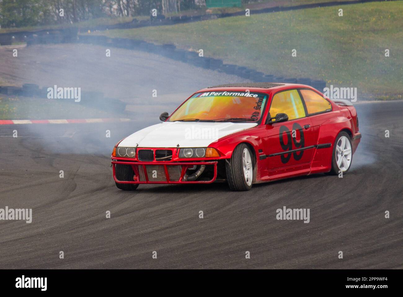 BMW Car No.99 burning rubber and tires screeching at Three Sisters Race ...