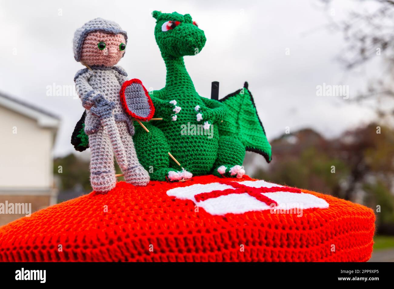 Poole, Dorset, UK. 23rd April 2023. A knitted crocheted postbox topper ...