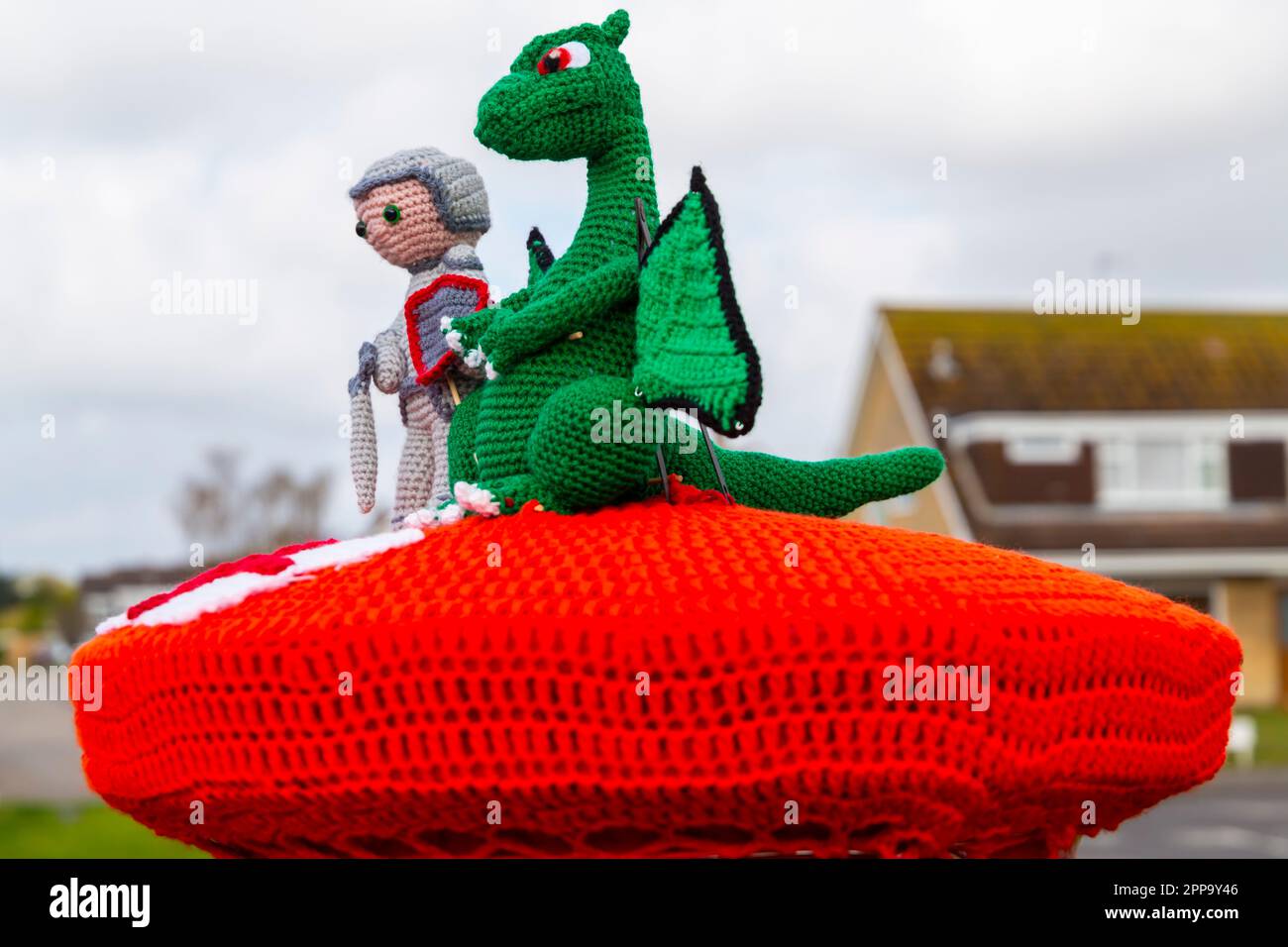 Poole, Dorset, UK. 23rd April 2023. A knitted crocheted postbox topper ...