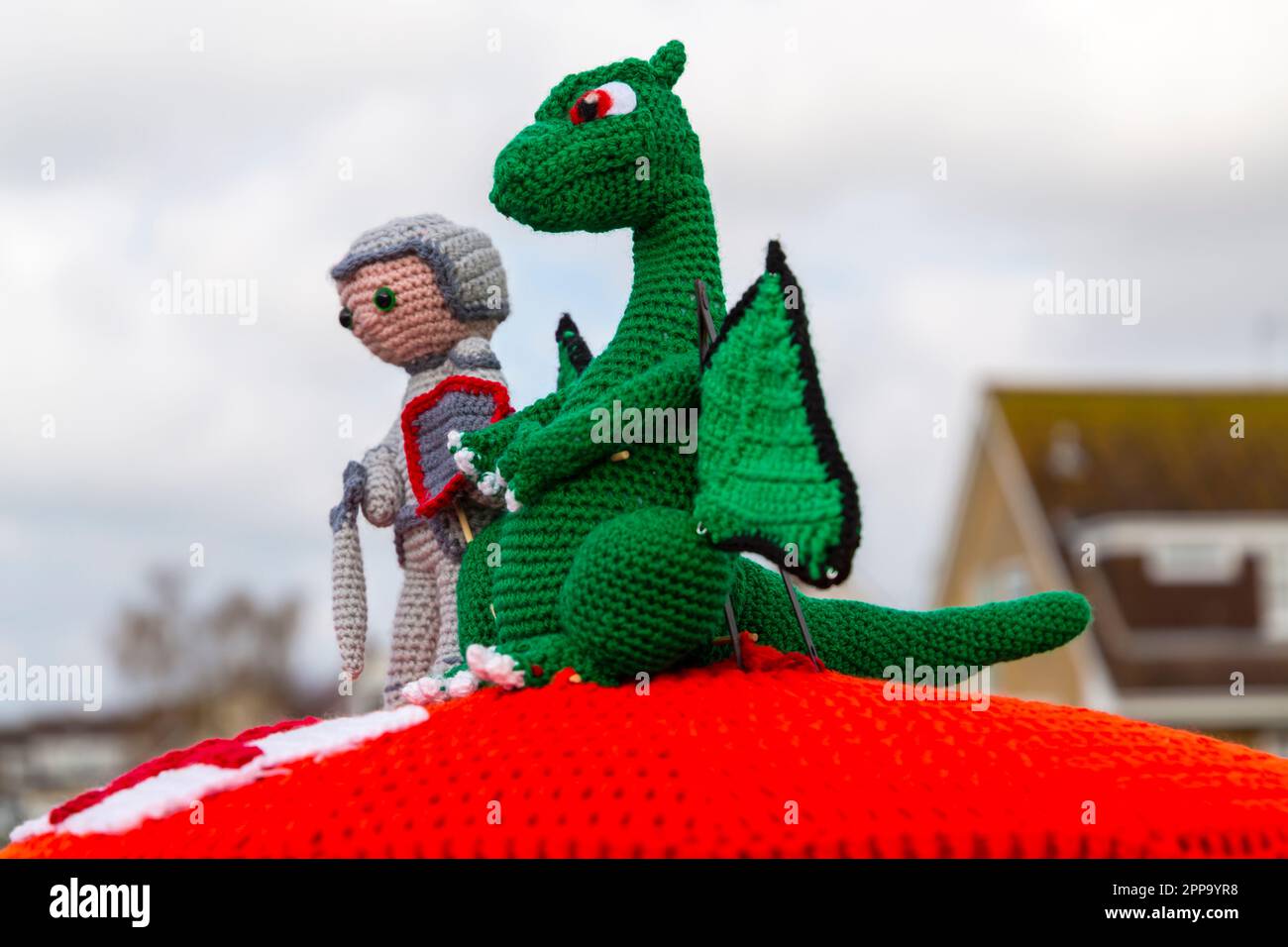 Poole, Dorset, UK. 23rd April 2023. A knitted crocheted postbox topper ...