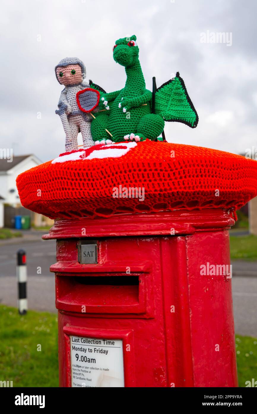 Poole, Dorset, UK. 23rd April 2023. A knitted crocheted postbox topper ...