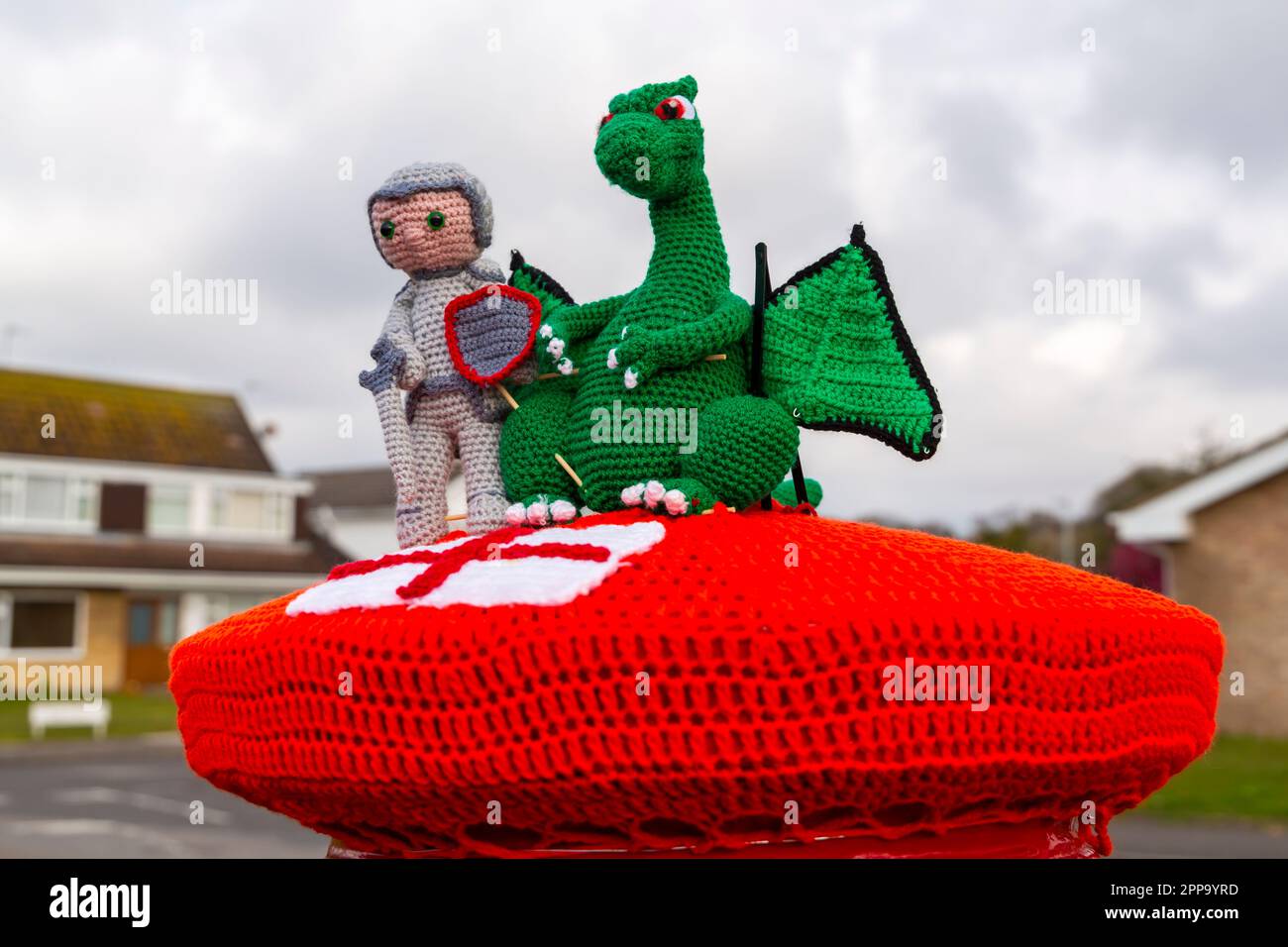 Poole, Dorset, UK. 23rd April 2023. A knitted crocheted postbox topper ...