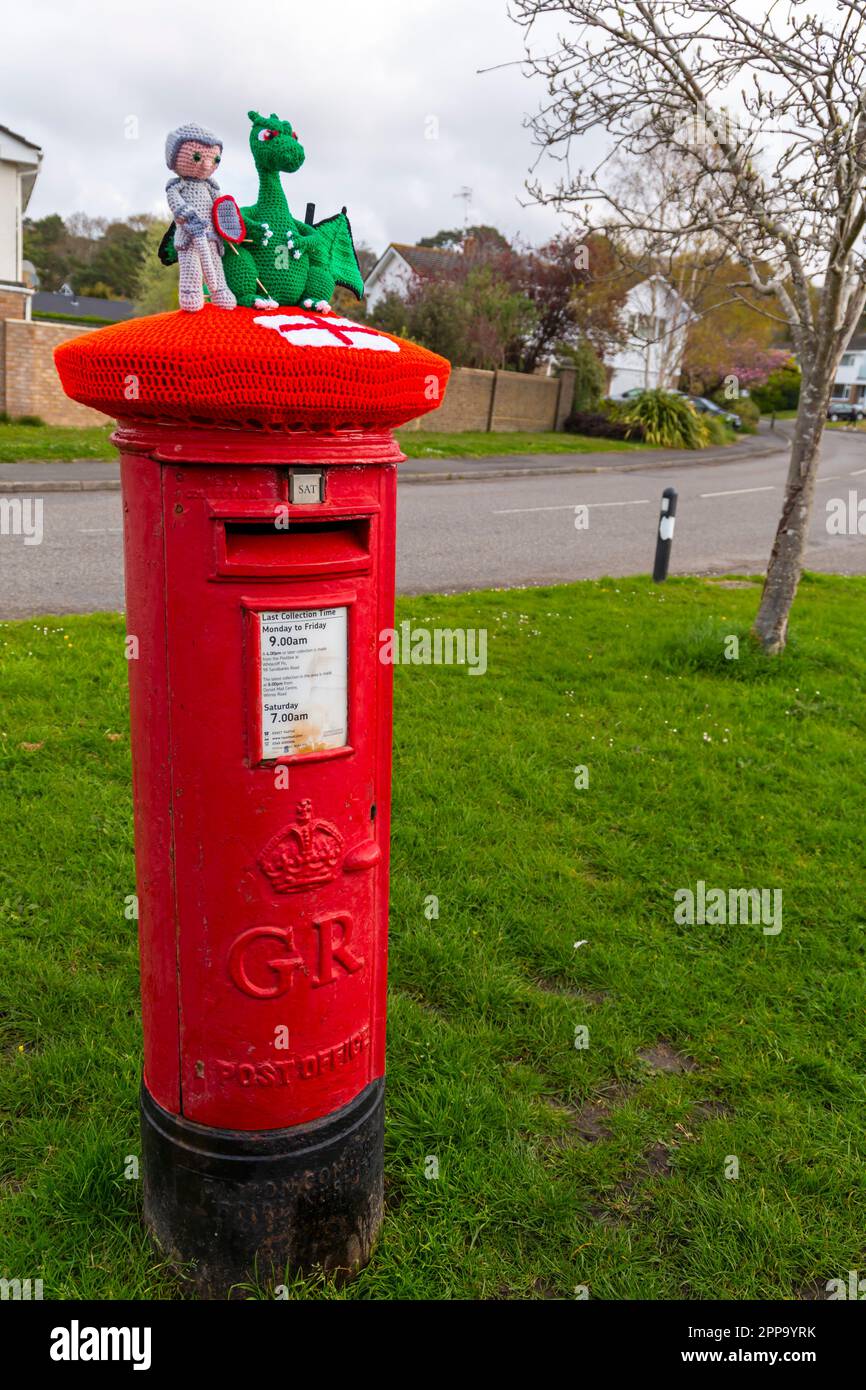 Poole, Dorset, UK. 23rd April 2023. A knitted crocheted postbox topper ...
