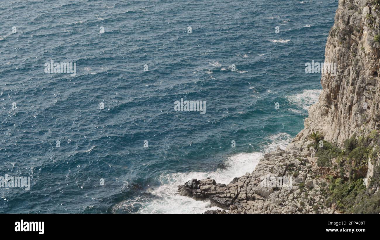 Azure waves of mediterranean sea splashing on French Riviera coast ...