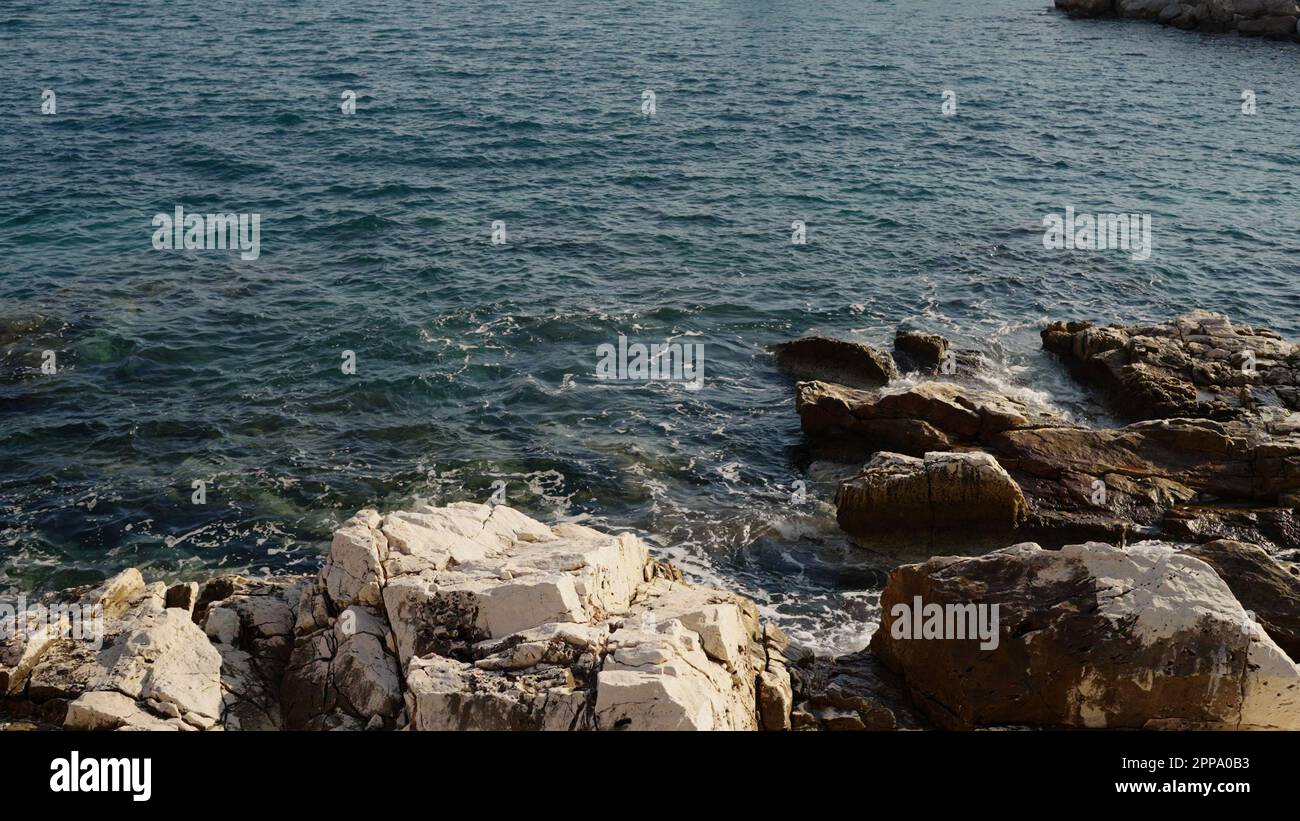 Azure waves of mediterranean sea splashing on French Riviera coast ...
