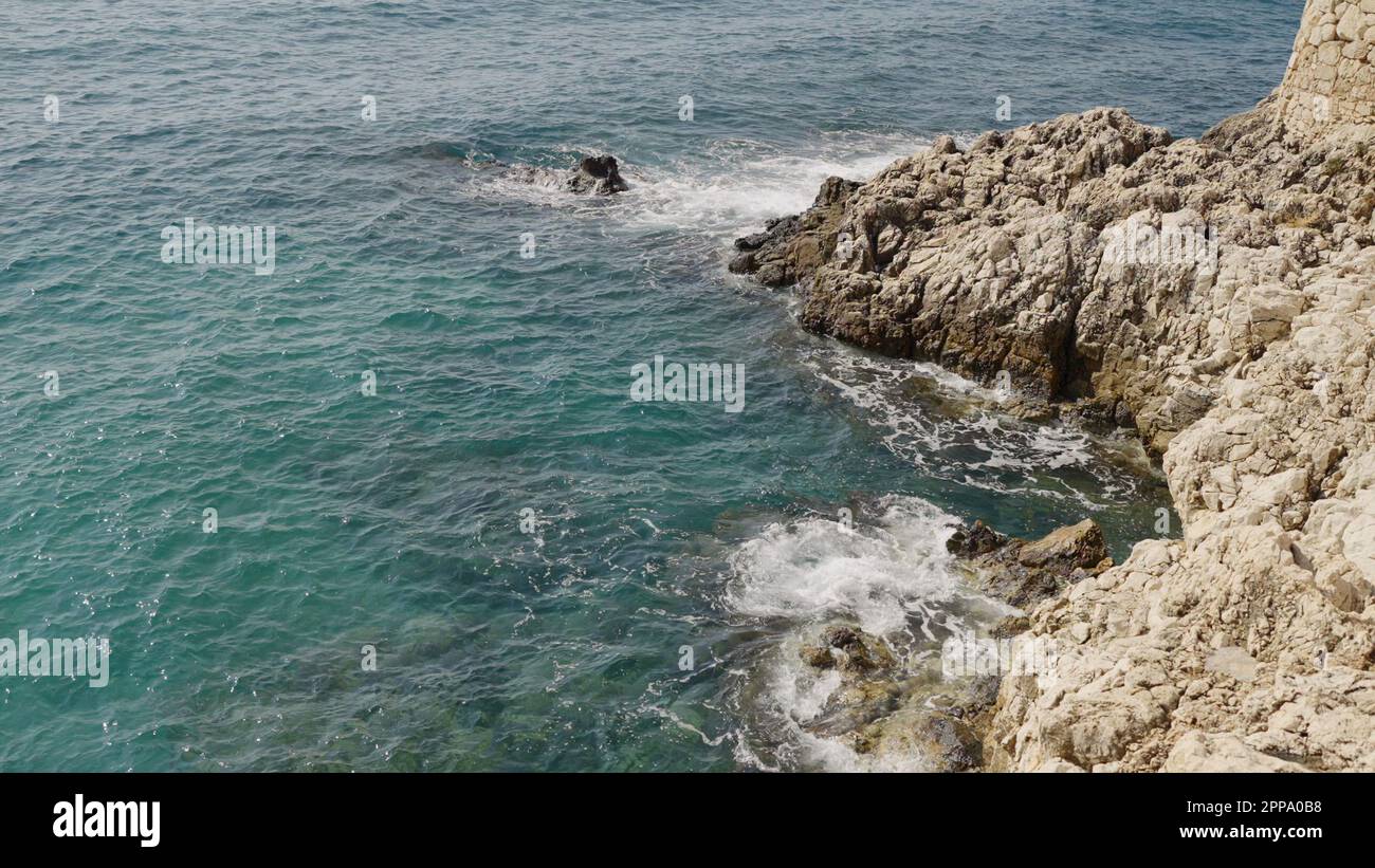 Azure waves of mediterranean sea splashing on French Riviera coast ...