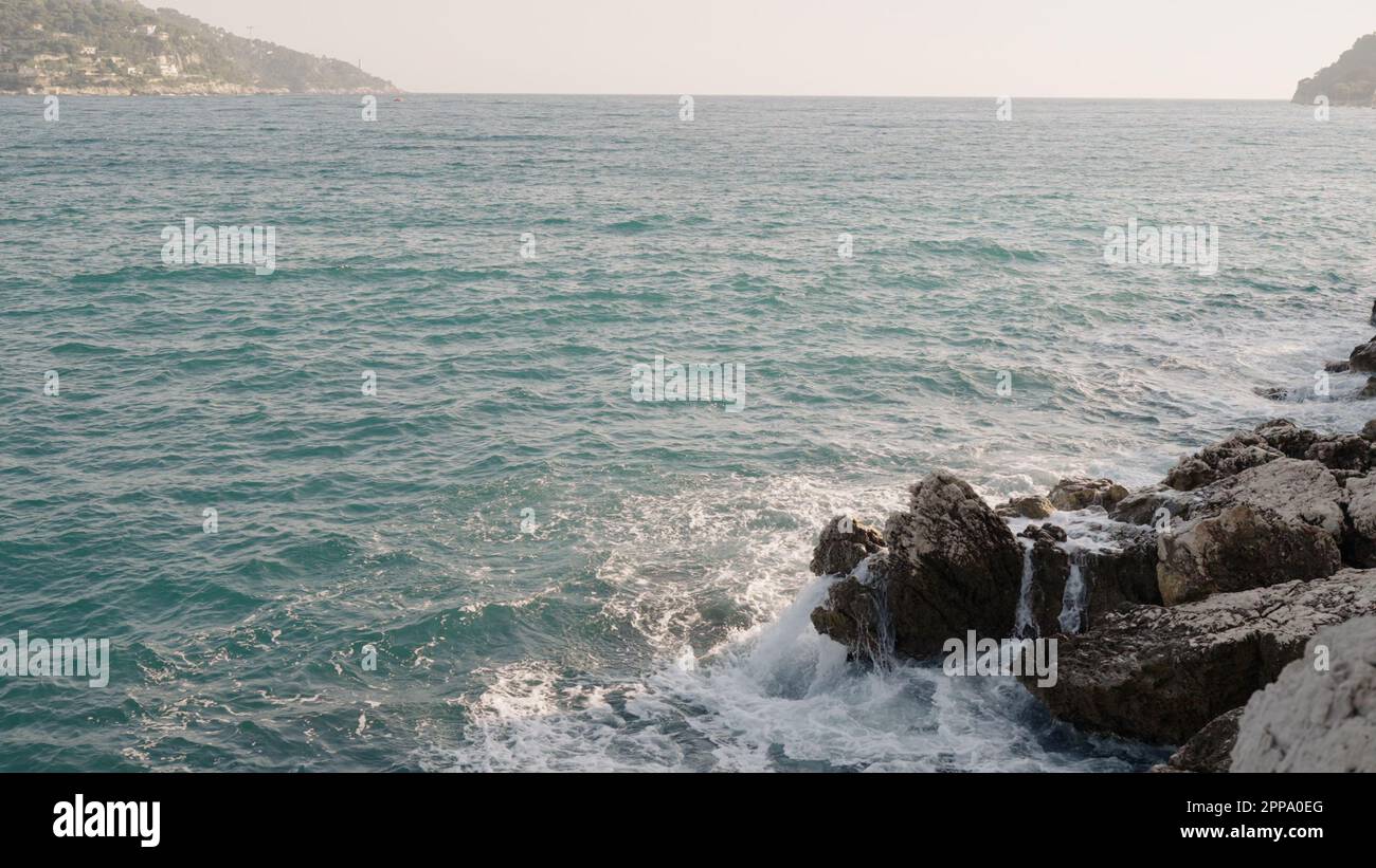 Azure waves of mediterranean sea splashing on French Riviera coast ...