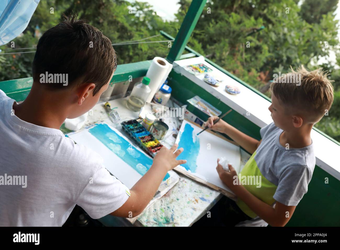 Portrait of brothers drawing oil painting on terrace Stock Photo - Alamy