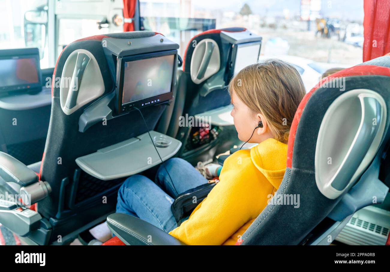 Girl listening music in chair hi-res stock photography and images - Alamy