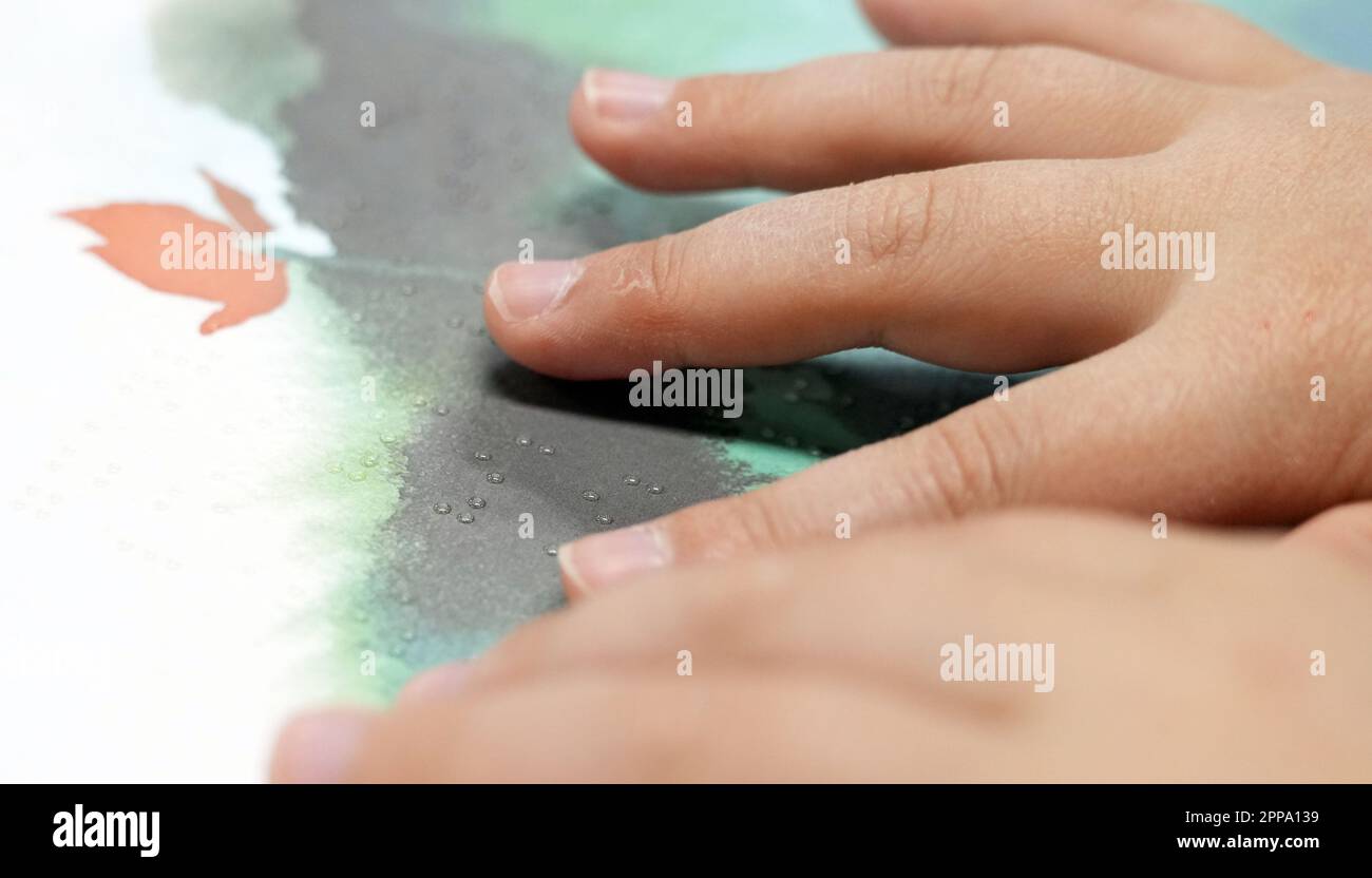 Hangzhou, China. 20th Apr, 2023. A visually impaired child reads a ...