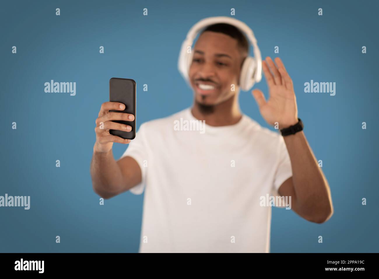Cell phone in cool black guy hand, telecom app Stock Photo - Alamy