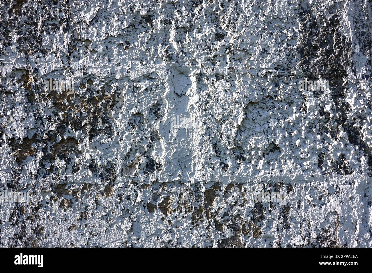 Old scabrous uneven wall painted surface as background front view close ...