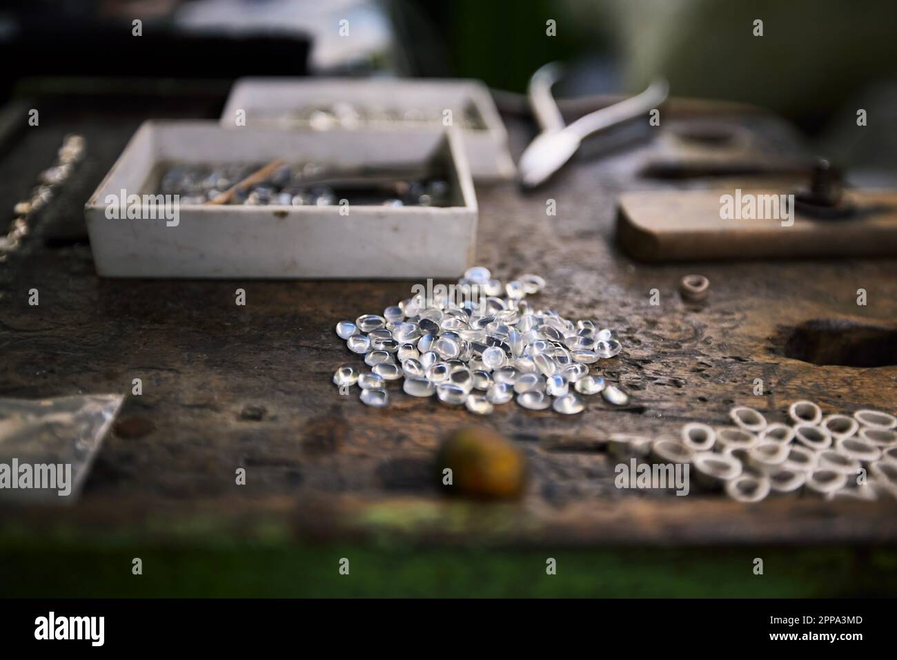Pile of processed Moonstones ready for jewelry making on work table ...