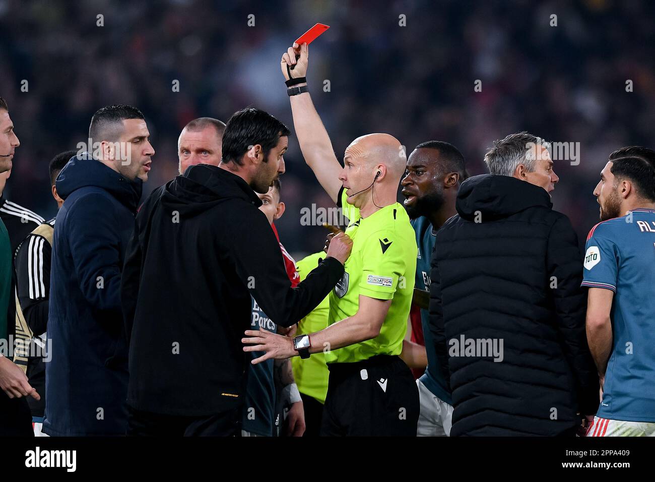 Referee Anthony Taylor shows a red card to Salvatore Foti coach ...
