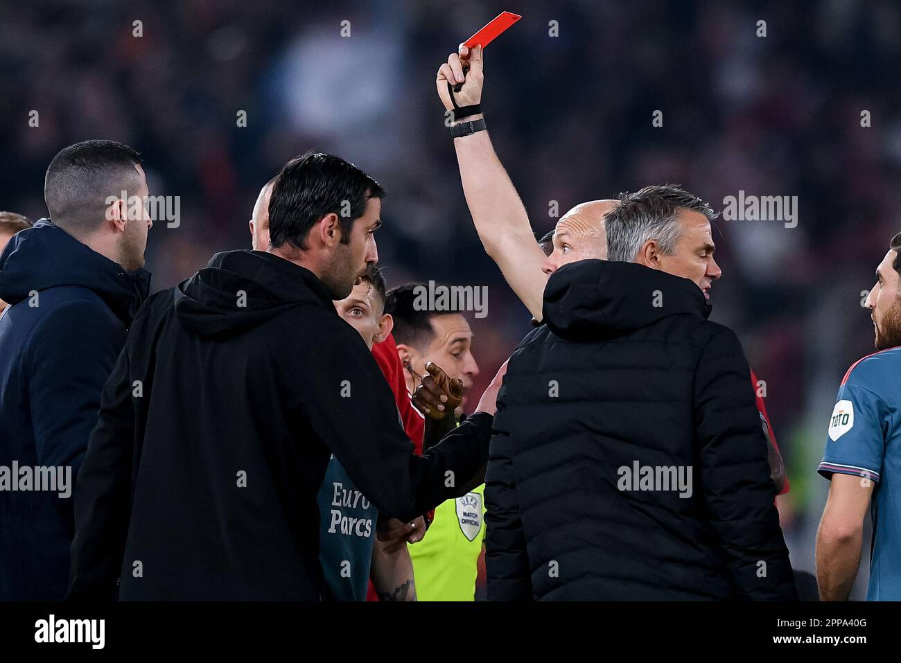 Referee Anthony Taylor shows a red card to Salvatore Foti coach ...