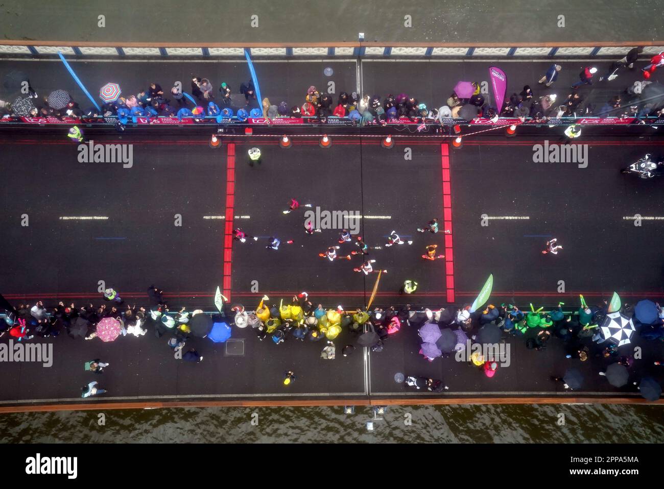 Athletes in the Men's elite race cross Tower Bridge during the TCS ...