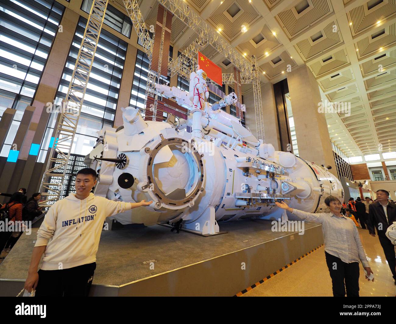 BEIJING, CHINA - APRIL 23, 2023 - Visitors pose for photos with a model ...