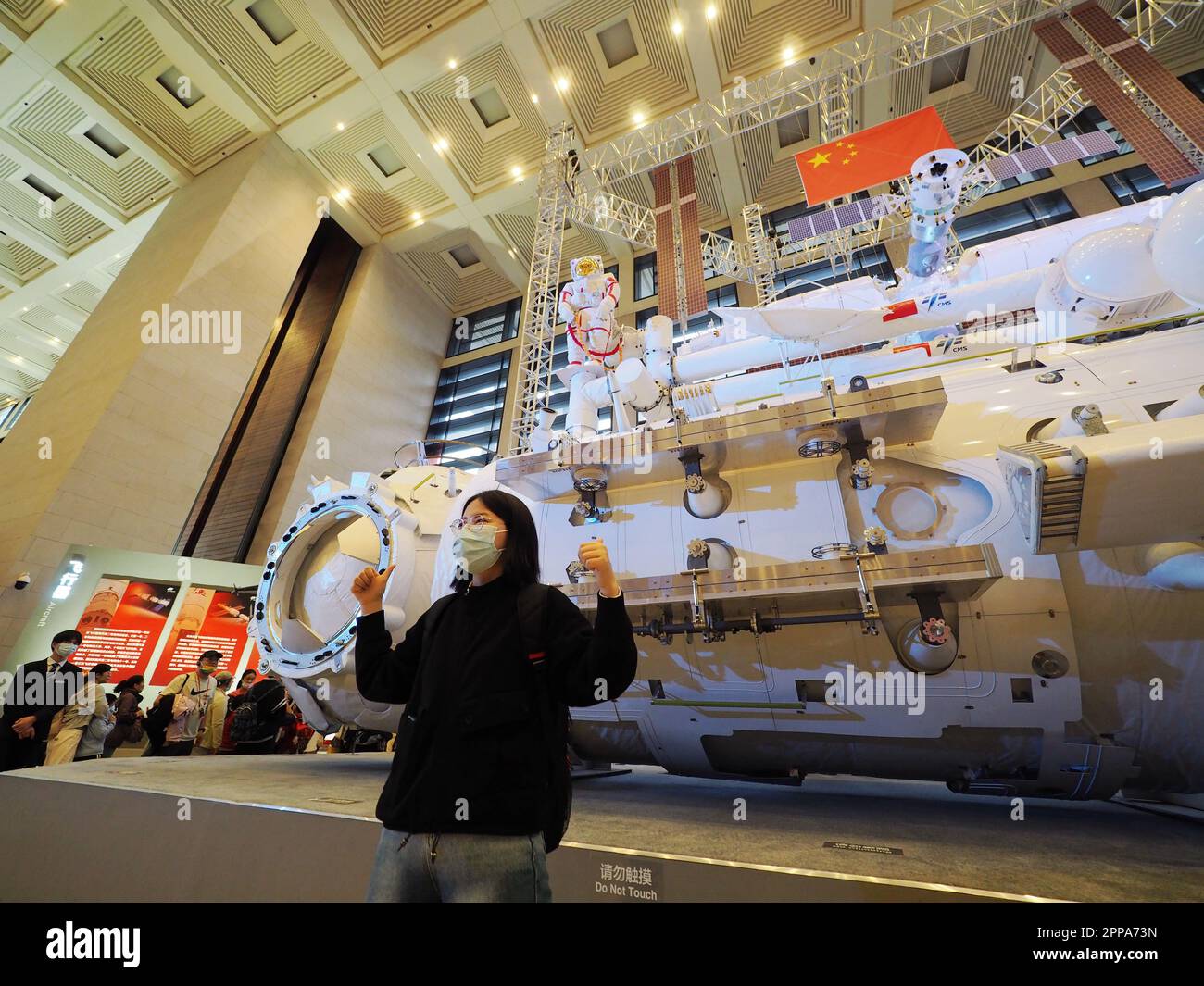 BEIJING, CHINA - APRIL 23, 2023 - A visitor poses for a photo with a ...