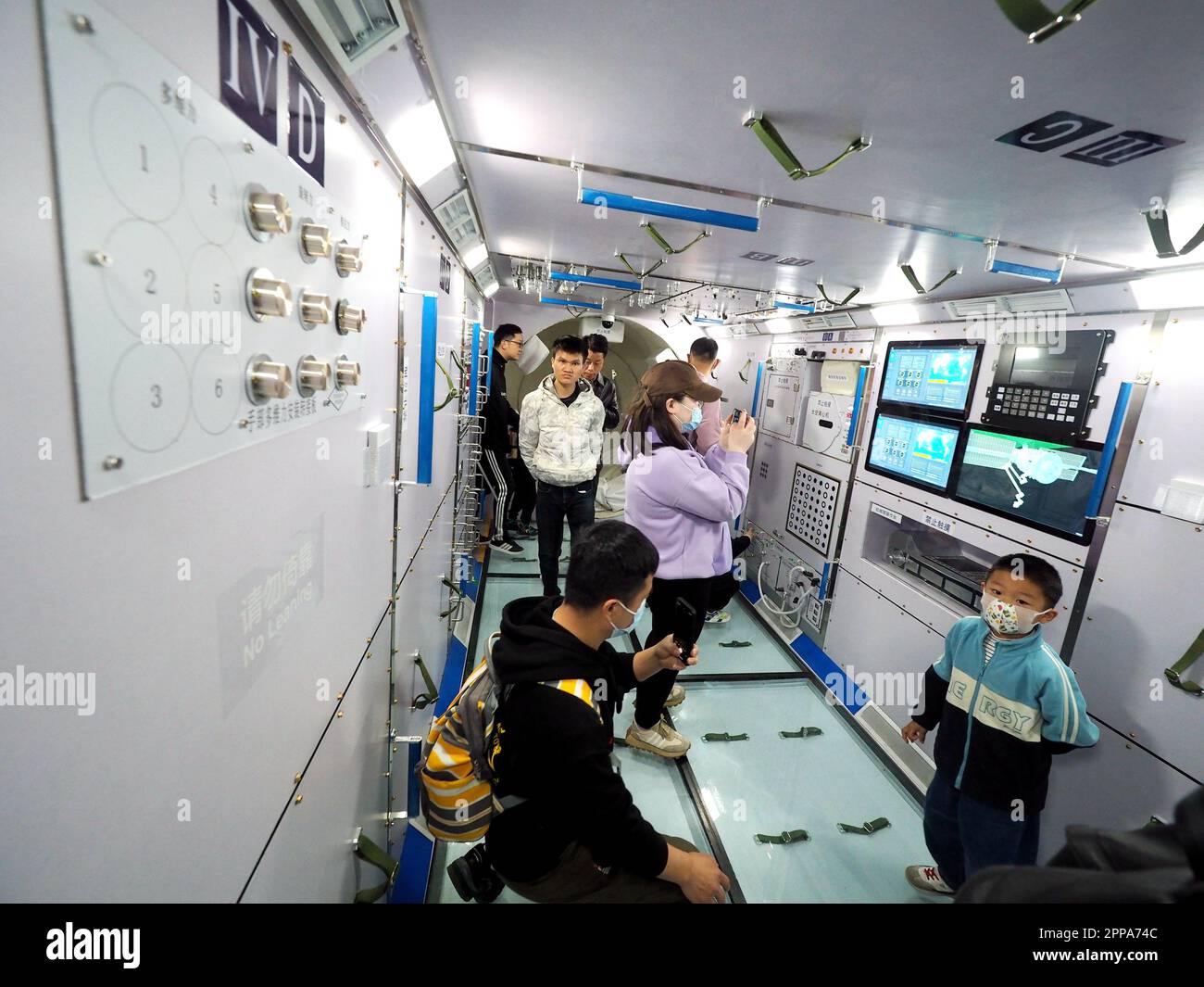 BEIJING, CHINA - APRIL 23, 2023 - Visitors look inside a model of the ...