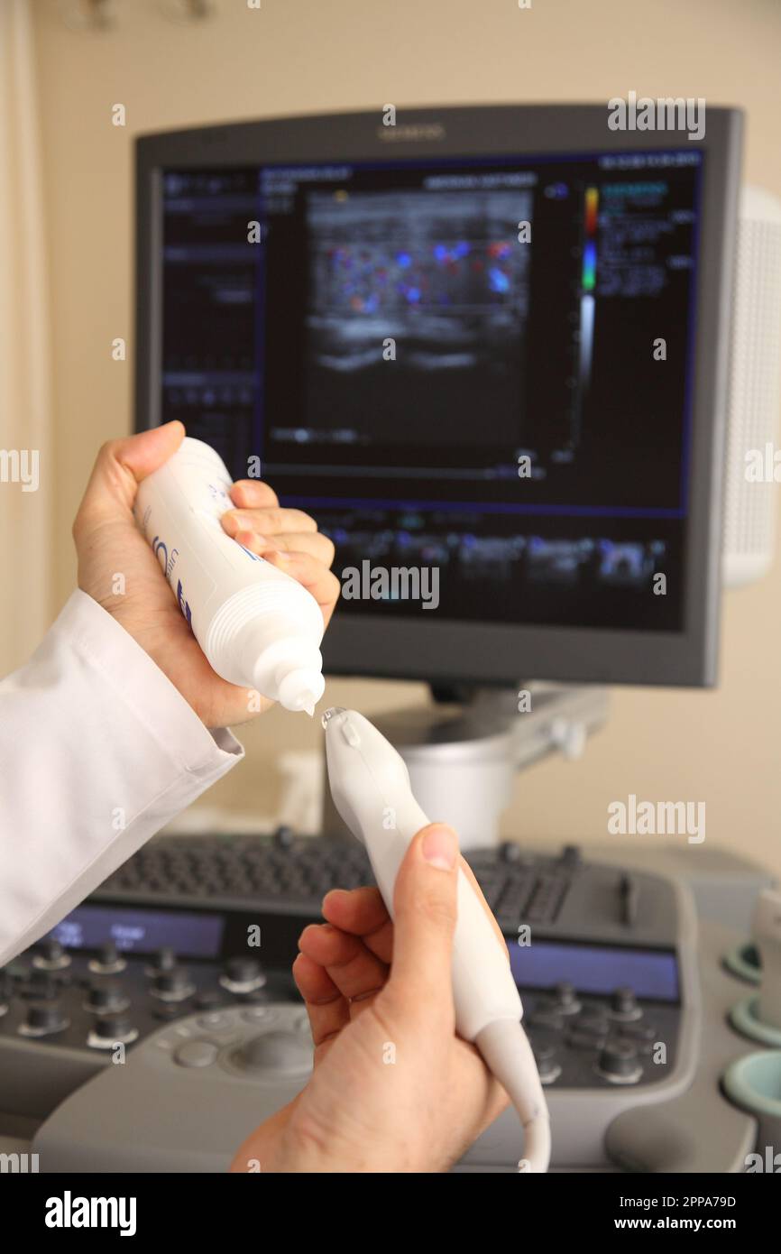 A close-up of a medical professional performing a transthoracic ...
