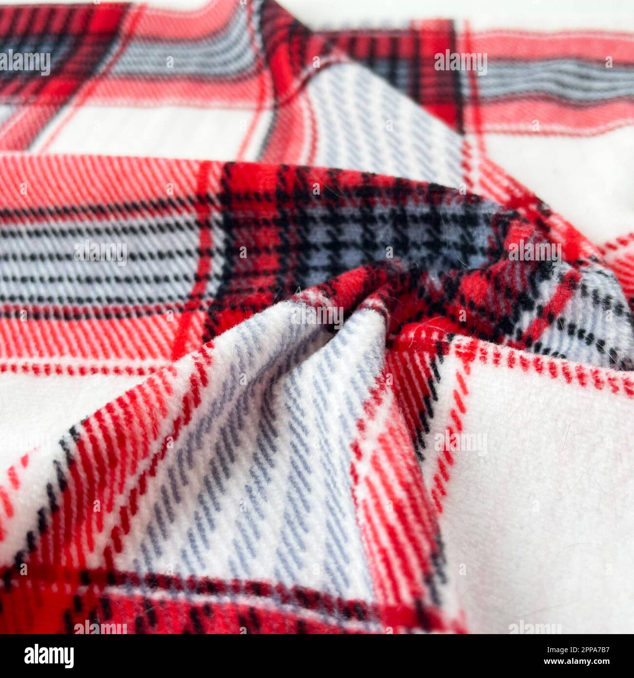 With a tartan check plaid background hi-res stock photography and ...