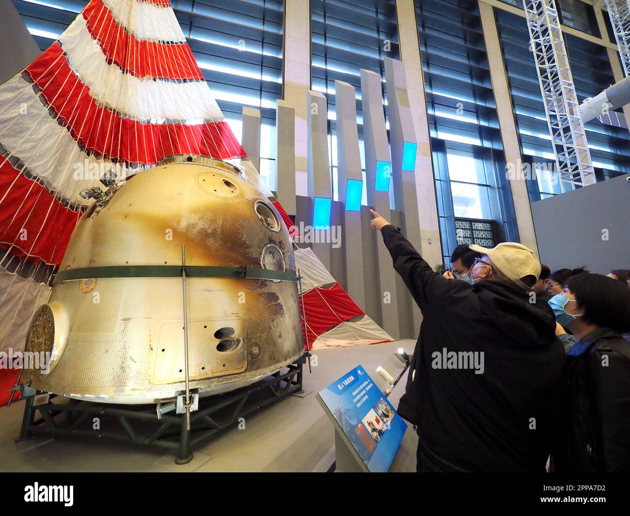 BEIJING, CHINA - APRIL 23, 2023 - Visitors view the re-entry capsule of ...